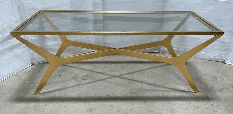 Gold colored coffee table with glass top, 51"W x 19 1/2"D x 20"H, good ...