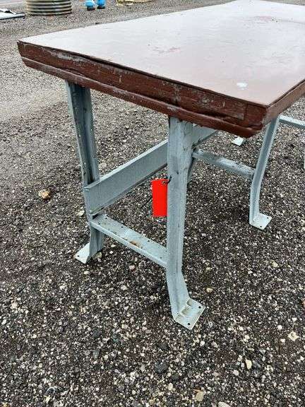 Very heavy duty workbench, 2 x 10's with masonite top on three steel legs, will hold a ton of ...