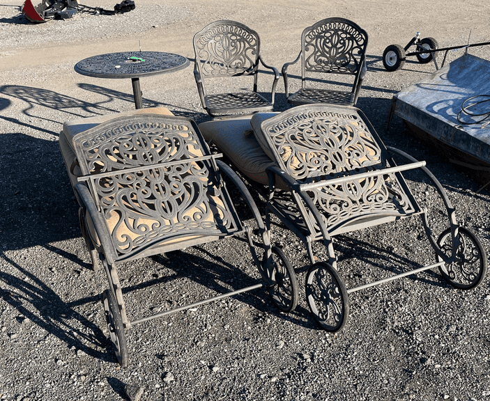Metal patio set, includes: Table, (2) Spinning chairs, and (2) long ...