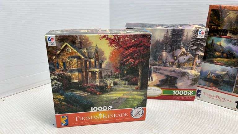 Assorted puzzles, include: (10) Thomas Kinkade puzzles in one box, includes: Four- 500-piece ...