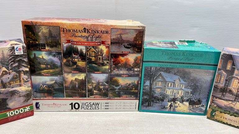 Assorted puzzles, include: (10) Thomas Kinkade puzzles in one box, includes: Four- 500-piece ...