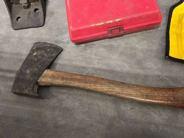 Rolling tool box full of assorted tools, crow bars, hammer heads, nut ...