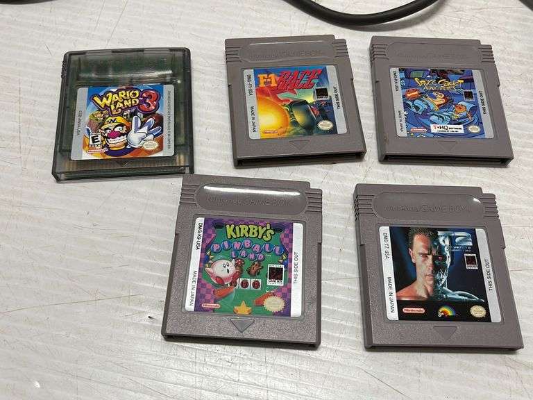 Playstation steering wheel controller wiht pedals, some GameBoy games, and a GameBoy case/pouch ...