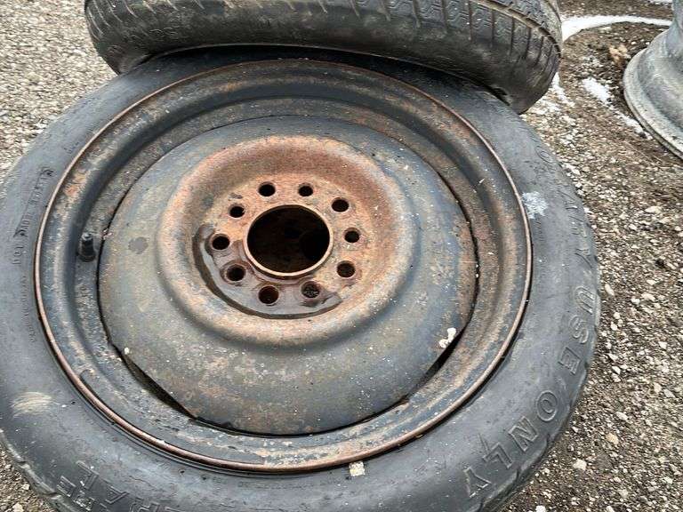 (2) Donut tires on rims, 5-hole and 10-hole; Misc. tire on 4-hole rim ...