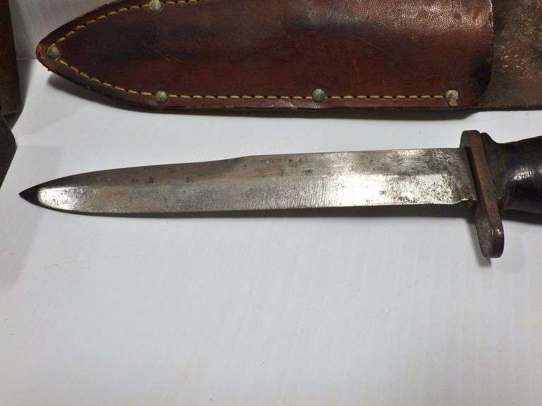 Bayonet with leather handle and sheath, locking spring still intact ...