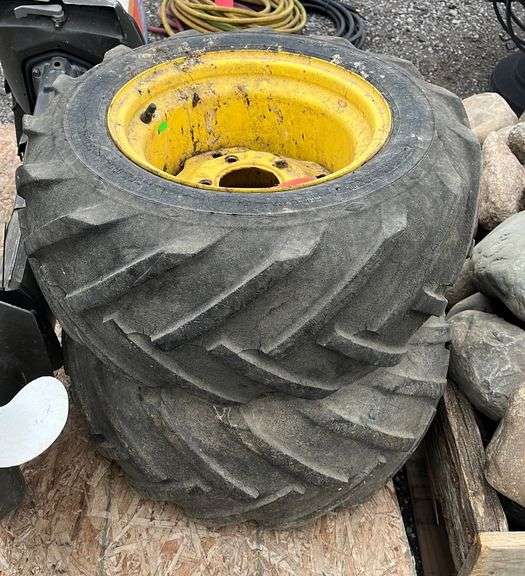 (2) John Deere garden tractor wheels and tires - Albrecht Auction Service