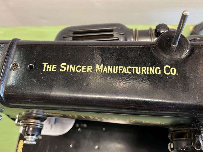 Singer 306K sewing machine in cabinet with chair full of sewing items ...