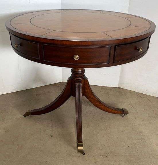 Ethan Allen round entry/library table on casters, has leather top and ...