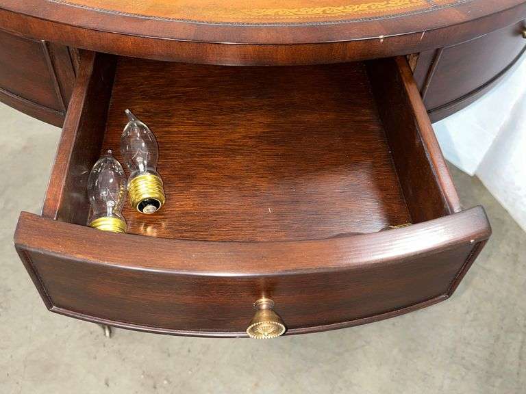 Ethan Allen round entry/library table on casters, has leather top and ...