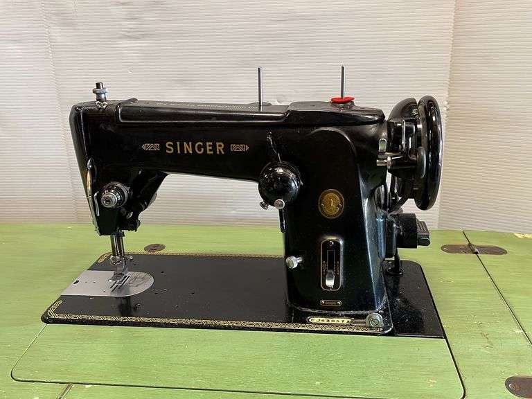 Singer 306K sewing machine in cabinet with chair full of sewing items ...