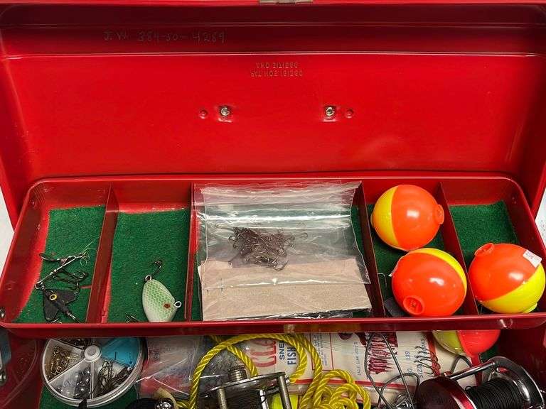 Red tackle box with assorted equipment, Blue box with lure, Yellow and ...