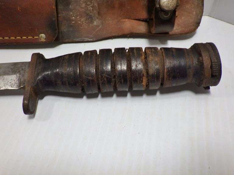Bayonet with leather handle and sheath, locking spring still intact ...