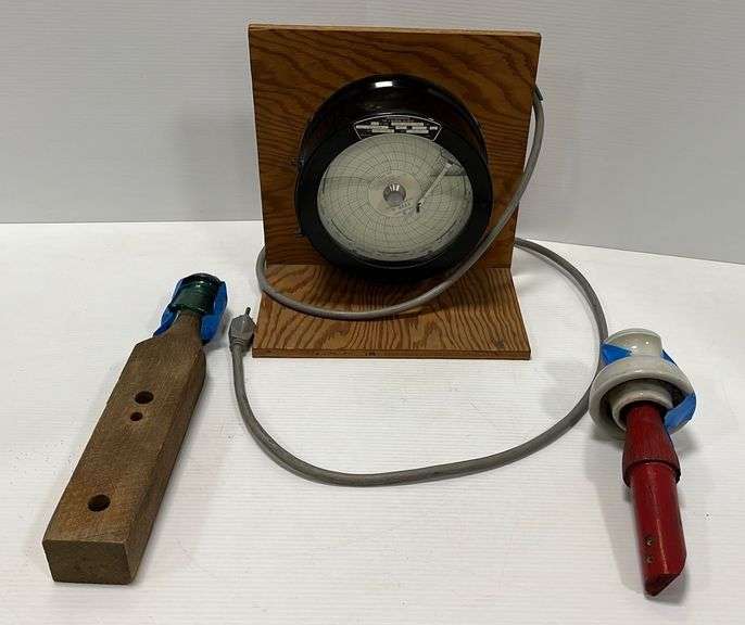 (2) Electrical insulators on pieces, red with ceramic and wood with ...