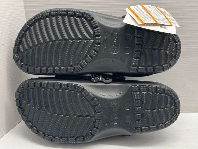Pair of men's Crocs, Bogota roomy fit, black and gray in leather front ...