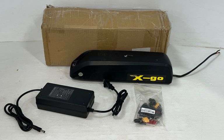 E-Bike battery and charger with bag of keys and other accessories, down ...
