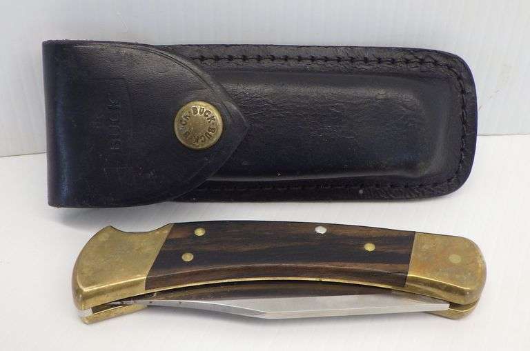 Model No. 110 and Buck knife with leather case, blade- 3 3/4"L, 8 1/2 ...
