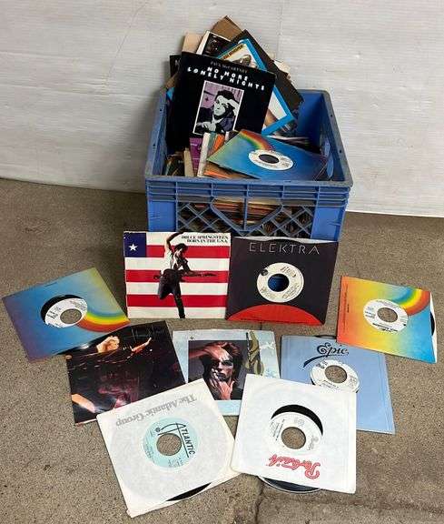 45 RPM albums in milk crate, many popular artists, includes: McCartney ...
