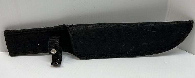 Knife with compartment in handle, 8 1/2" blade and saw type base on the ...