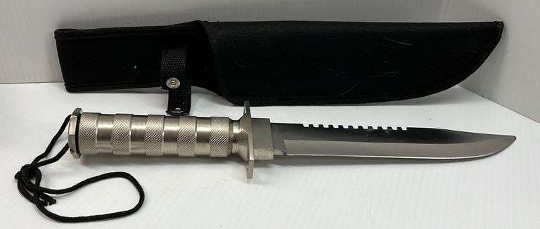 Knife with compartment in handle, 8 1/2" blade and saw type base on the ...