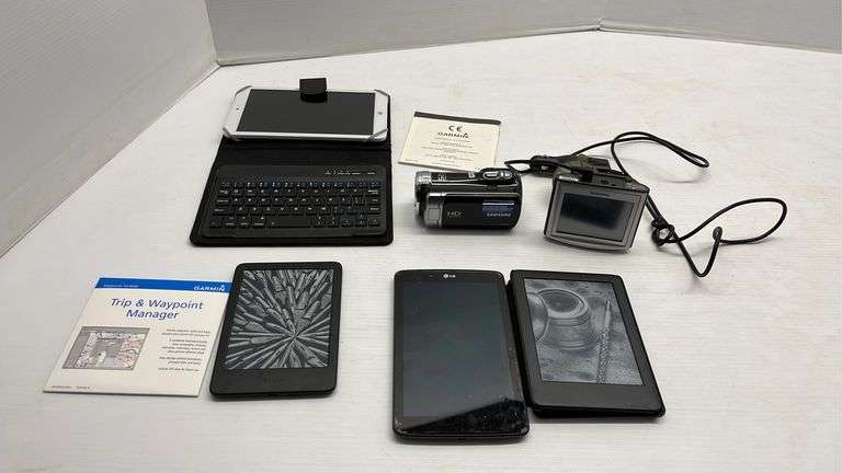 Kindles, tablets, GPS, and Samsung HD camcorder, GPS- 4"W, camcorder- 5 ...