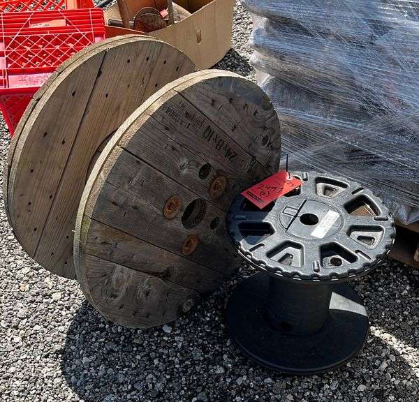 24" Wood spool, and 14" plastic spool - Albrecht Auction Service