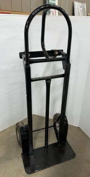 2-in-1 Dolly, pull handle out and reinsert in sockets over top casters ...