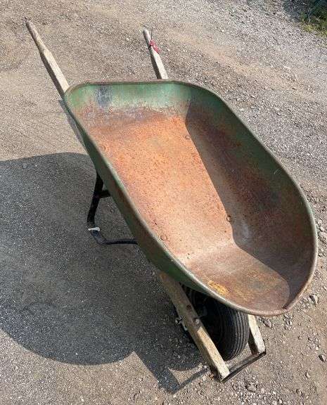 Wheelbarrow, 5'L, tire flat and has holes, used - Albrecht Auction Service