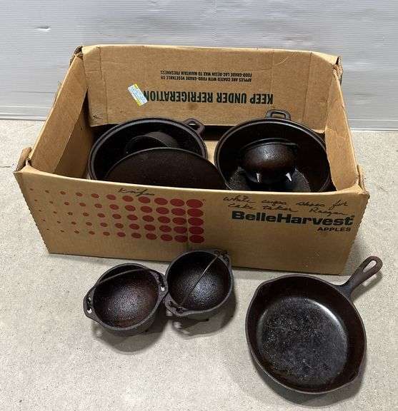 (7) Cast iron pans and a lid, includes: Cast iron pots with lid, 10"W x ...
