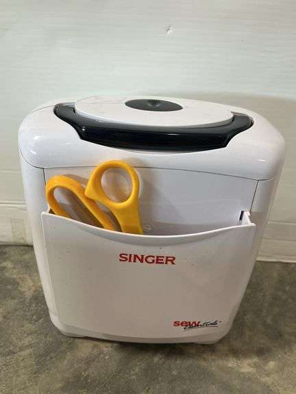 Assorted sewing items, include: Mighty Mender W100, Singer 4530C ...