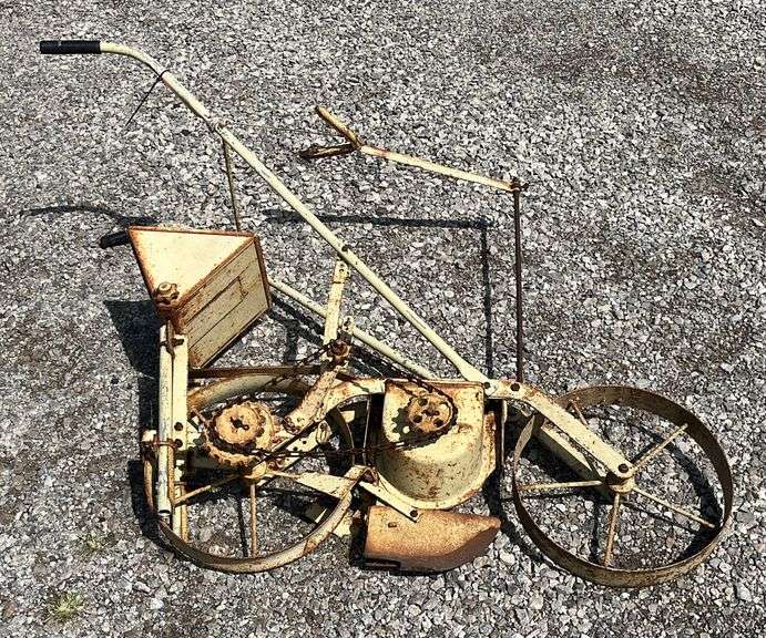 Seed planter with iron wheels, chassis, seed and fertilizer boxes ...