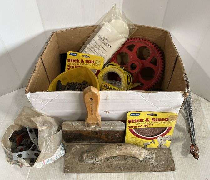 Old gears, new electronic fence insulators, bowl of old nuts, sandpaper pads, Craftsman safety ...