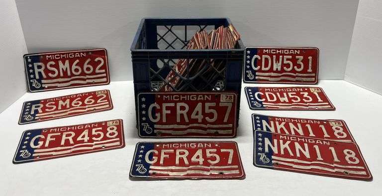 Crate of vintage 1970s license plates - Albrecht Auction Service
