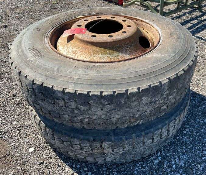 Tires on steel hub pilot rims, tires- 11R24.5, holds air, fair, 30% ...