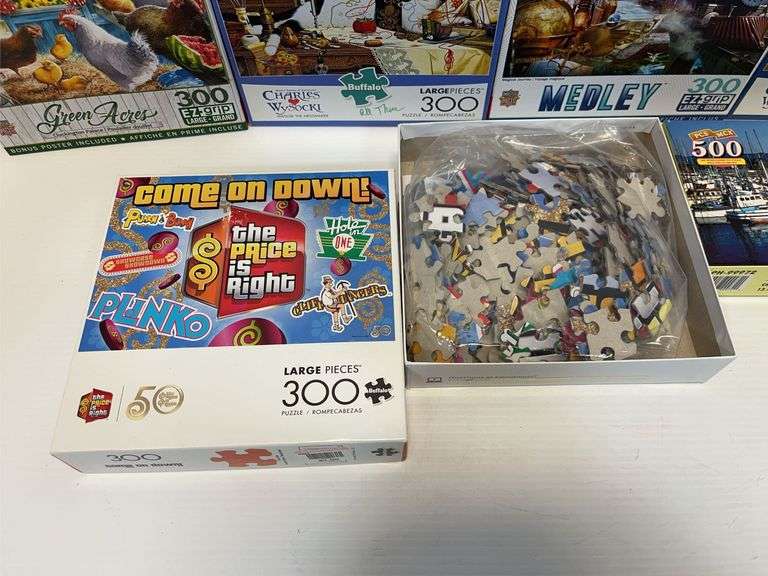 Puzzles, includes: Six- 300; and One- 300 - Albrecht Auction Service
