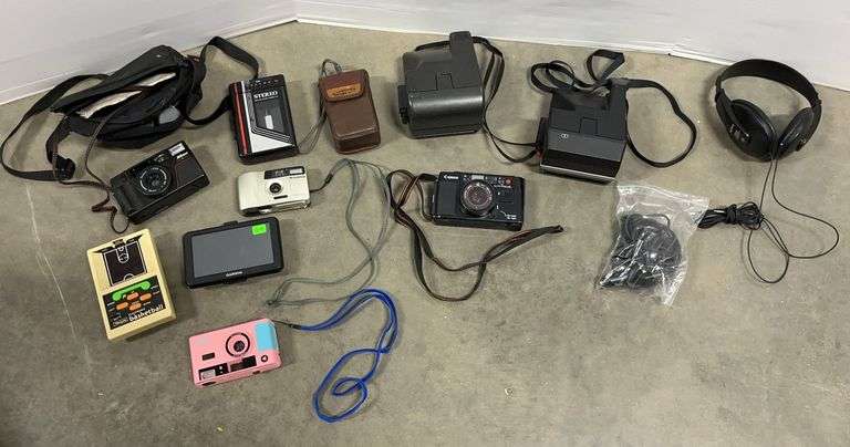 (7) Cameras, tape player Nuvi GPS, headphones, and handheld video ...