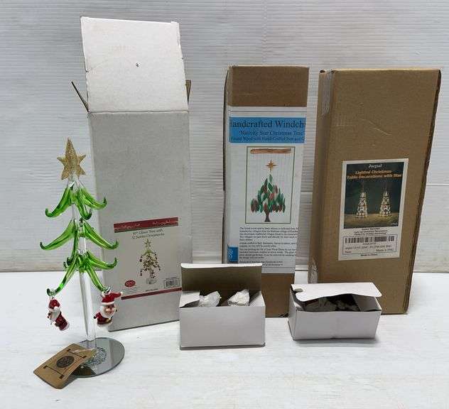 Handcrafted wind chimes, decorative table trees, and a glass tree with ...