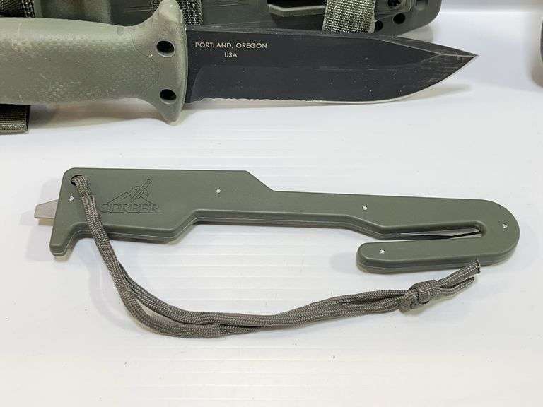 Gerber safety tool with seatbelt cutter and window punch; Gerber combat ...