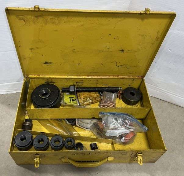 Yellow Enerpac tool case with a few metal punches inside, various sizes ...