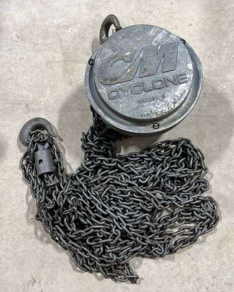 Cyclone chain hoist with long chain attached, has hooks and is well ...