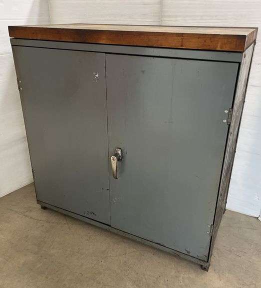 Industrial steel parts storage cabinet with butcher block top, from a ...