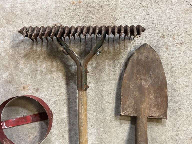(2) Antique potato planters, old metal thatcher, antique trench shovel ...