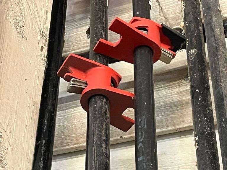 (4)-Pipe Clamps and (2)-Metal Poles - Albrecht Auction Service