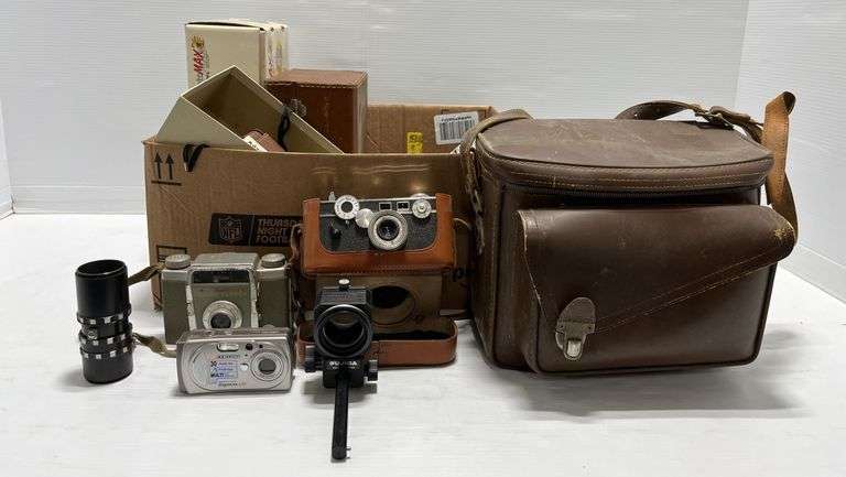 Box of older camera equipment, film cameras, digital cameras, lens ...