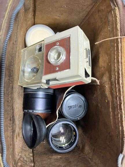 Box of older camera equipment, film cameras, digital cameras, lens ...
