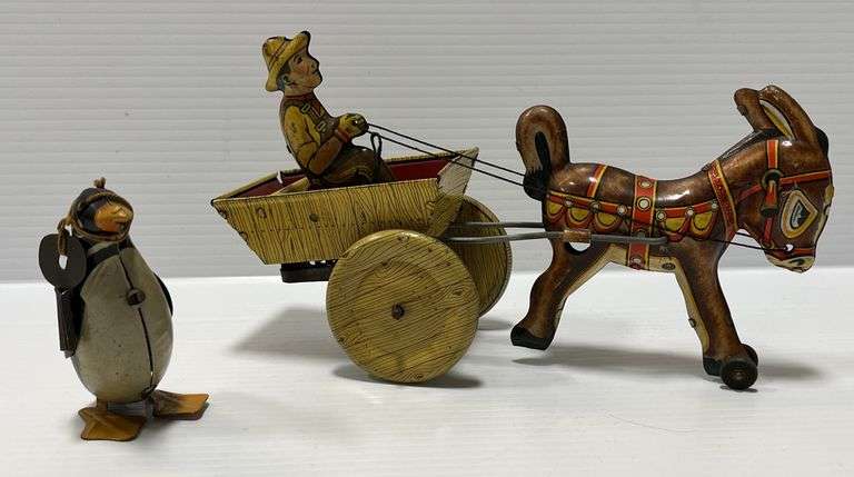 Antique wind-up tin toys, includes: Donkey and cart, also Penguin ...