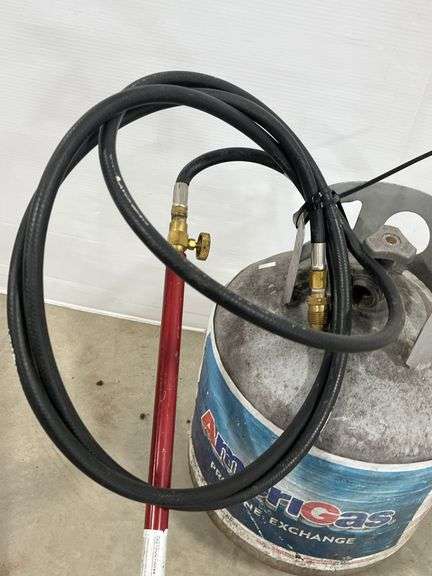 Flamethrower or weed burner with propane tank, used to burn ditch banks ...