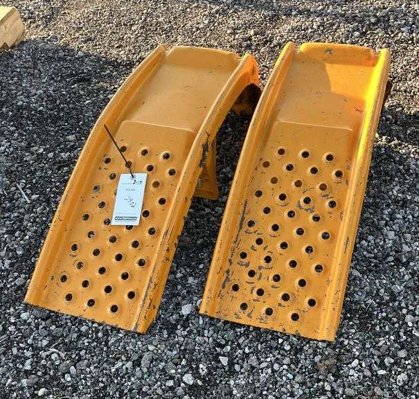 Set of (2) metal yellow ramps, each- 35"L, used - Albrecht Auction Service