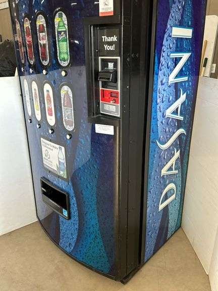 Coca-Cola vending machine, Model No. RVCC 660-9, machine cools, but ...