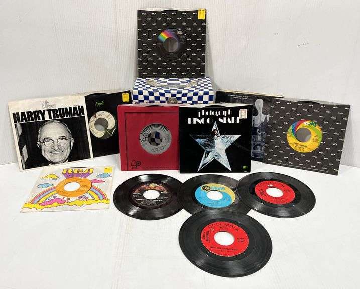 (12) 1970s 45 RPM records in a checkered record case, pop and rock ...