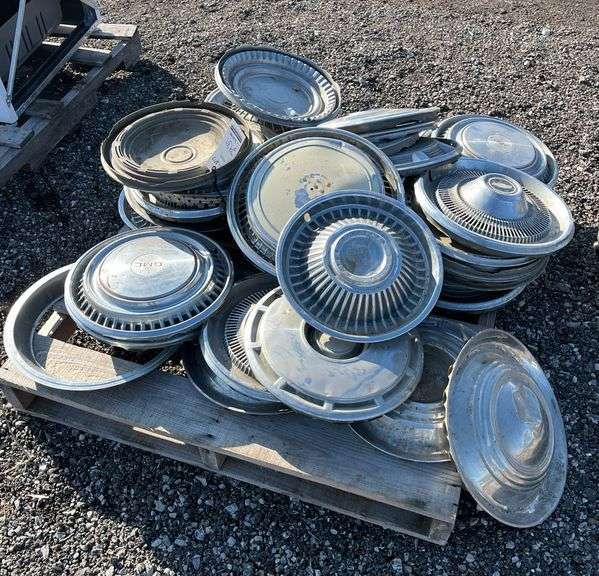 Assorted antique hubcaps - Albrecht Auction Service